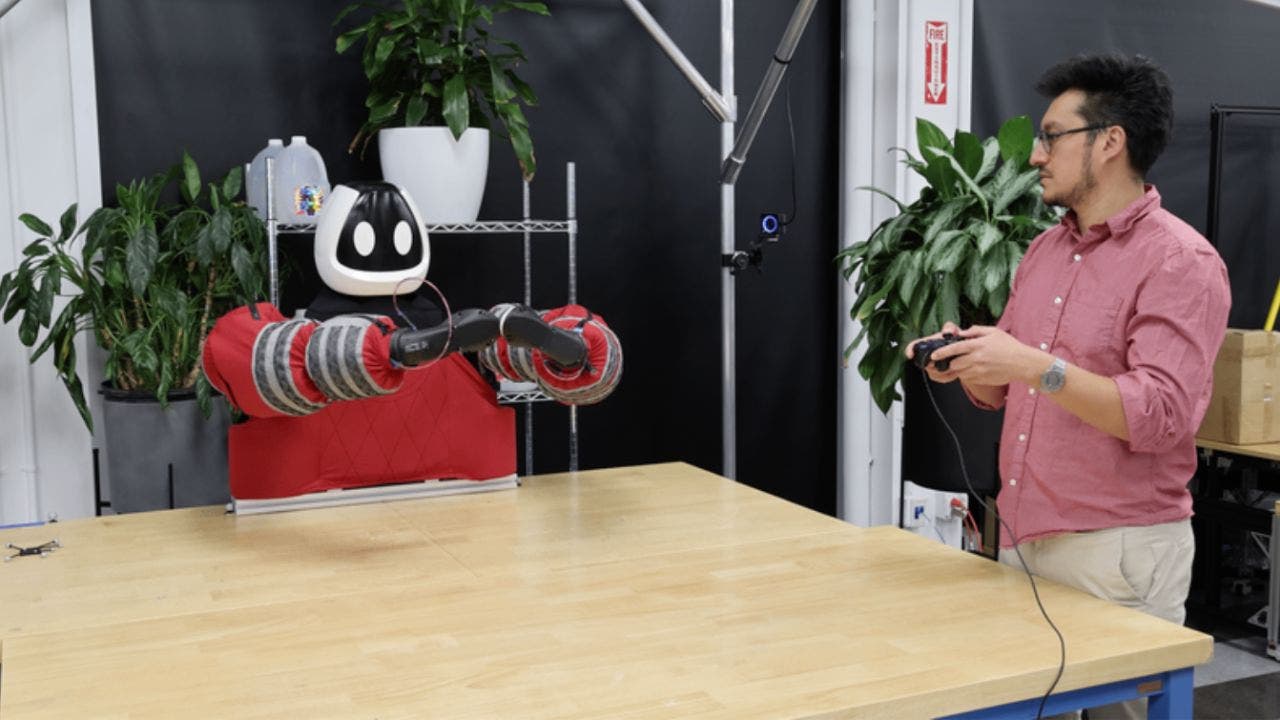 Toyota's robot is equipped to pick up objects with its entire body ...