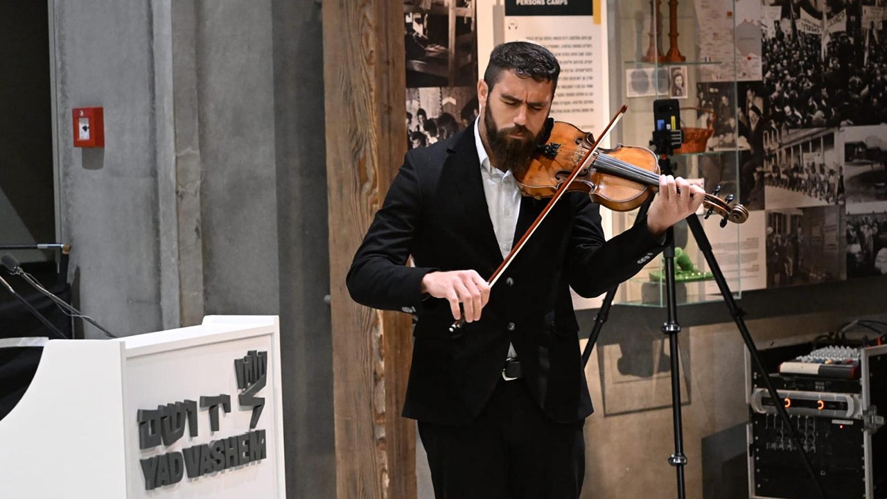 A Holocaust hero is honored by a Jewish soldier through the melody of ...